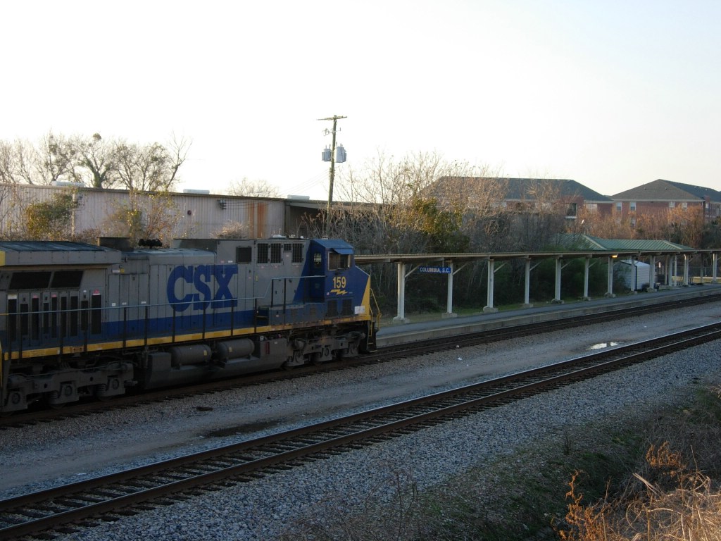 CSX 159 passes by the Amtrak platform